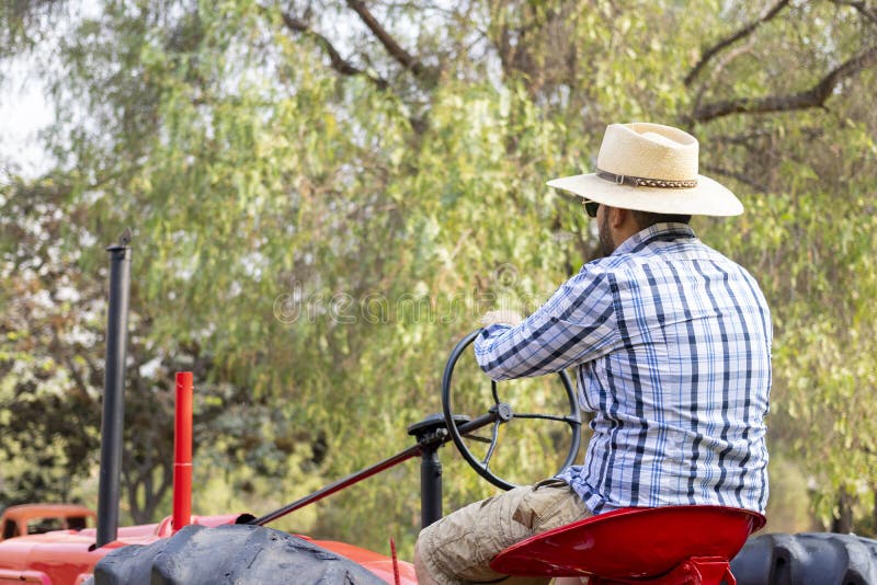 Handsome Man with Sunglasses Driving the Tractor To Work on the Farm ...