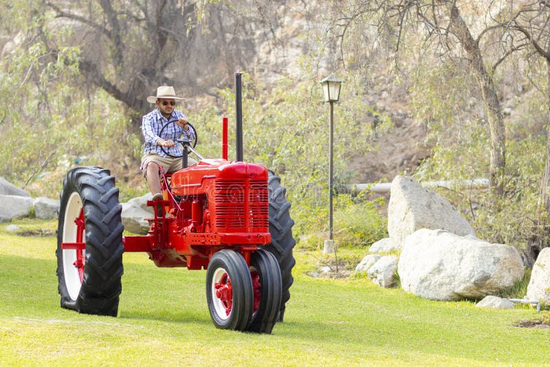 Handsome Man with Sunglasses Driving the Tractor To Work Stock Photo ...