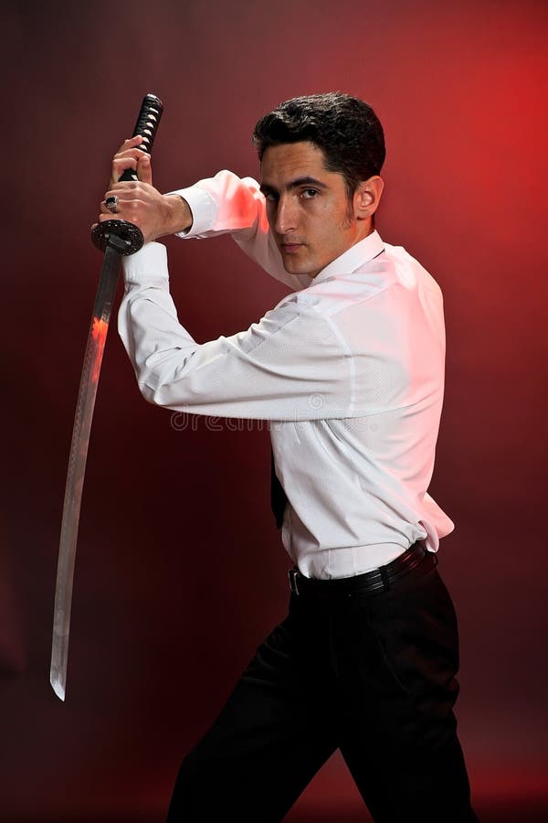 Handsome man with sword. stock photo. Image of unshaven - 23804968
