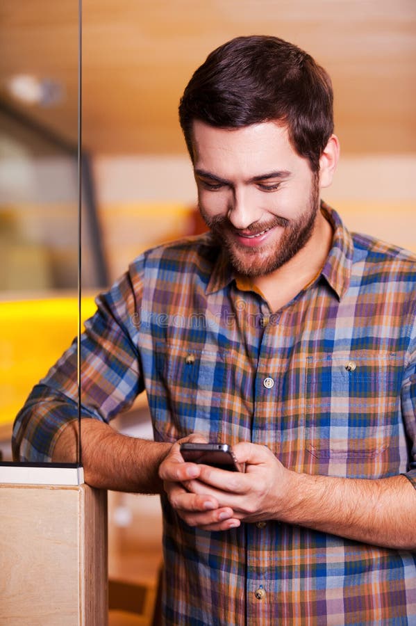 Handsome man texting. stock image. Image of cheerful - 47152119
