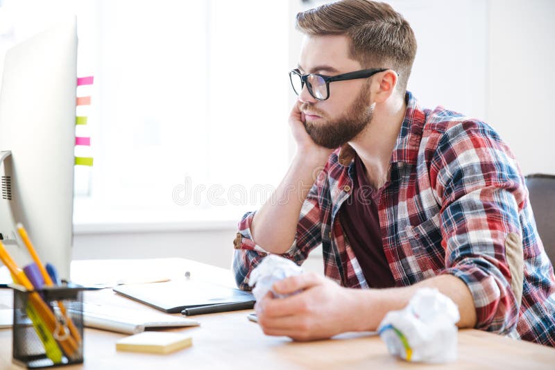 Handsome Man Thinking and Crumpling Paper on His Workplace Stock Photo ...