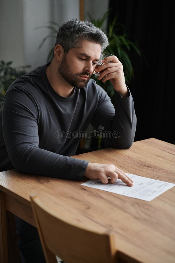 Handsome Man Thoughtfully Reviewing Documents Stock Photos - Free ...