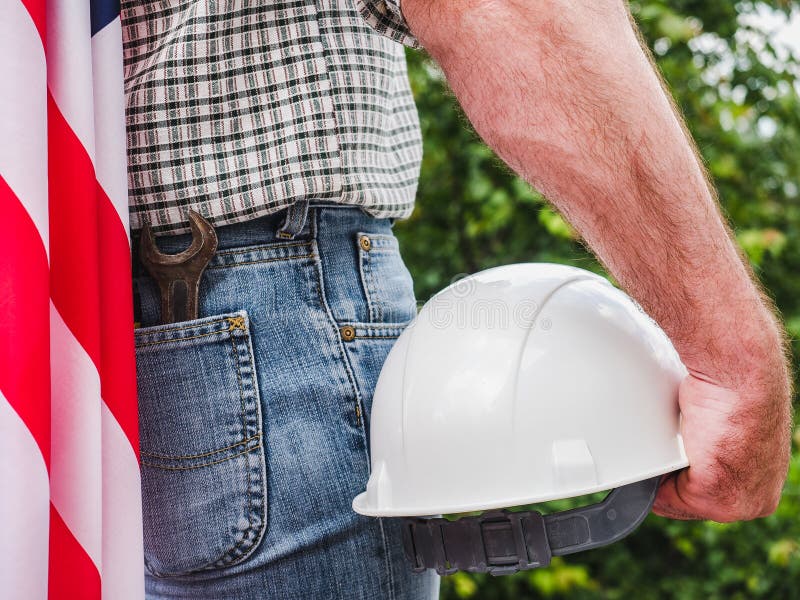 Handsome Man with Tools, Holding an American Flag Stock Photo - Image ...