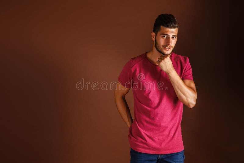 Handsome Man Touching Chin Looking at Camera Stock Photo - Image of ...