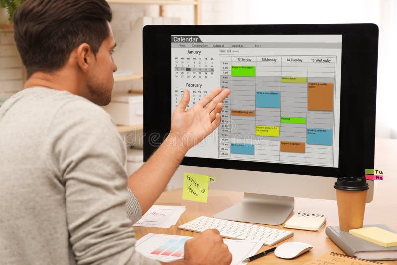 Handsome Man Using Calendar App on Computer Stock Image - Image of ...