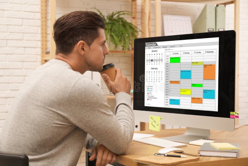 Handsome Man Using Calendar App on Computer Stock Image - Image of ...