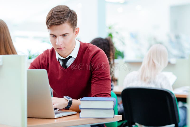 Handsome Man Using Laptop Computer Stock Photo - Image of book, people ...