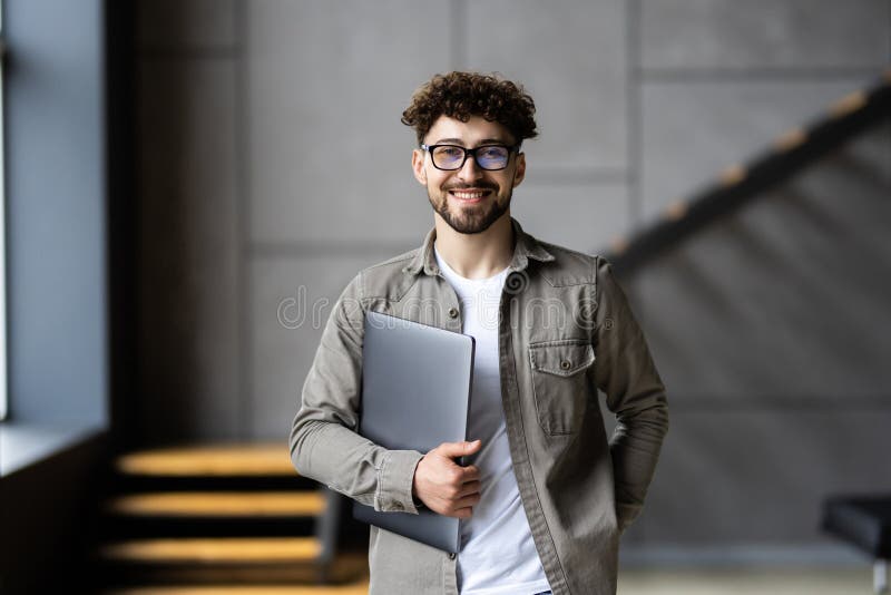 Handsome Man Using Laptop Computer while Standing at Home Stock Image ...
