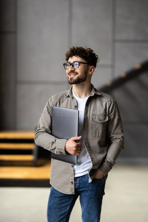 Handsome Man Using Laptop Computer while Standing at Home Stock Photo ...
