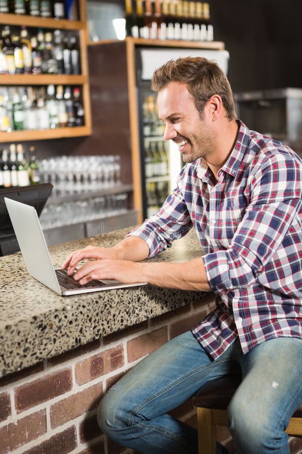 Handsome man using laptop stock image. Image of activities - 67562705