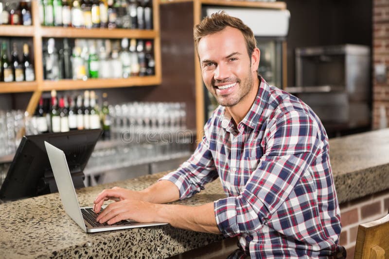 Handsome man using laptop stock image. Image of time - 67562707