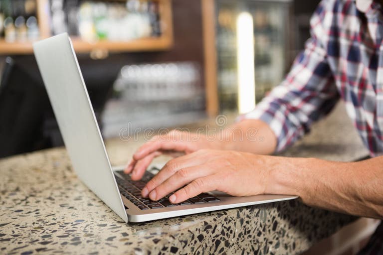 Handsome man using laptop stock photo. Image of activities - 67562724