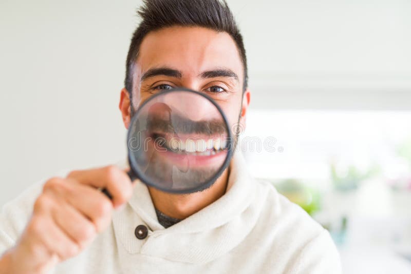 Handsome Man Using Magnifying Glass, Doing Funny Faces Stock Photo ...