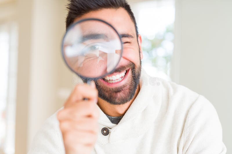 Handsome Man Using Magnifying Glass, Doing Funny Faces Stock Photo ...