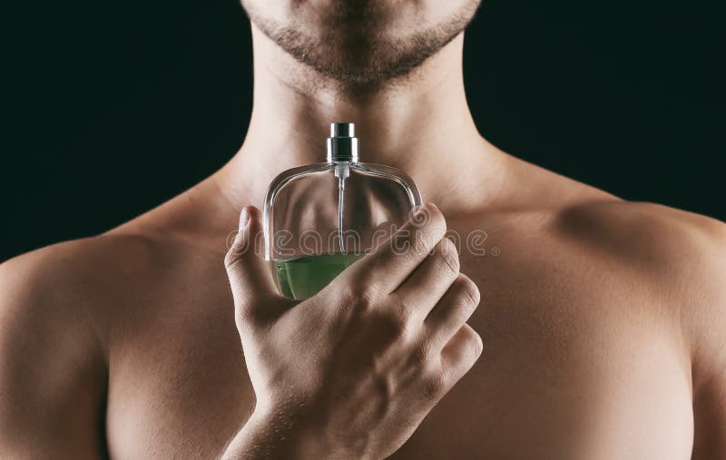 Handsome Young Man Using Perfume Stock Image - Image of deodorant ...