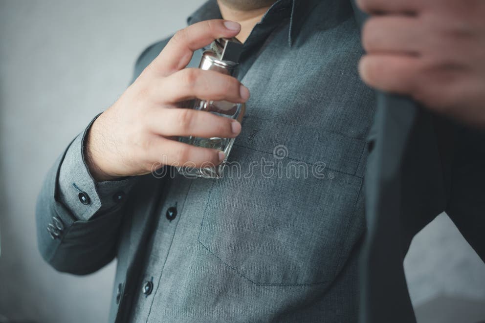 Handsome Man Using Perfume at Home Stock Photo - Image of advertisement ...