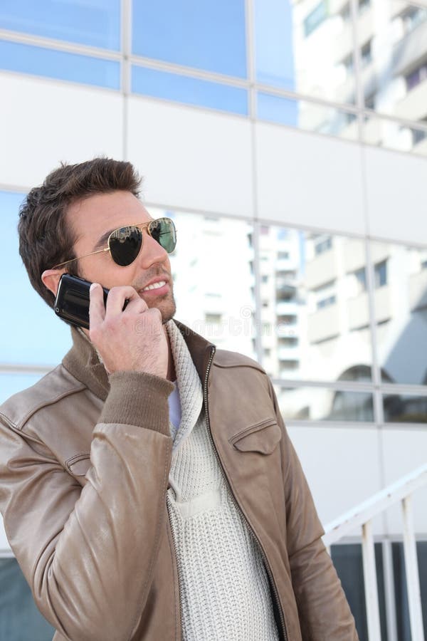 Happy Young Man with Smartphone. Talking on the Phone. Stock Image ...