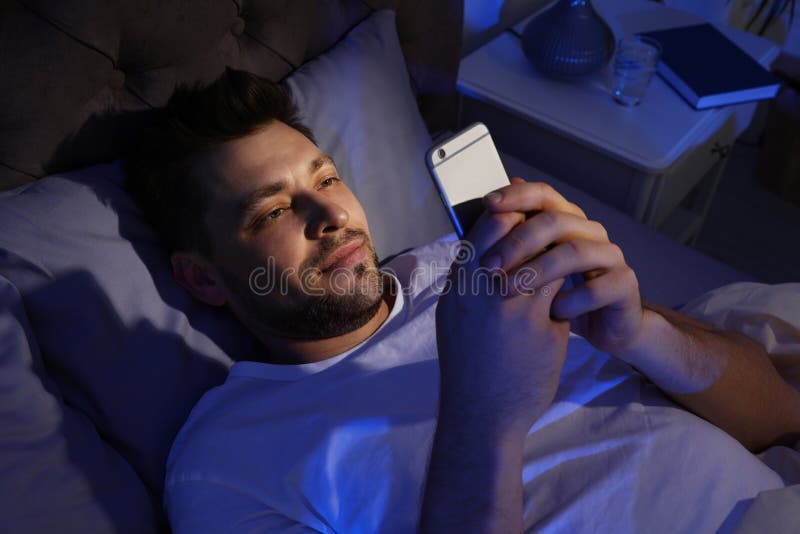 Handsome Man Using Smartphone in Dark Room at Night Stock Photo - Image ...