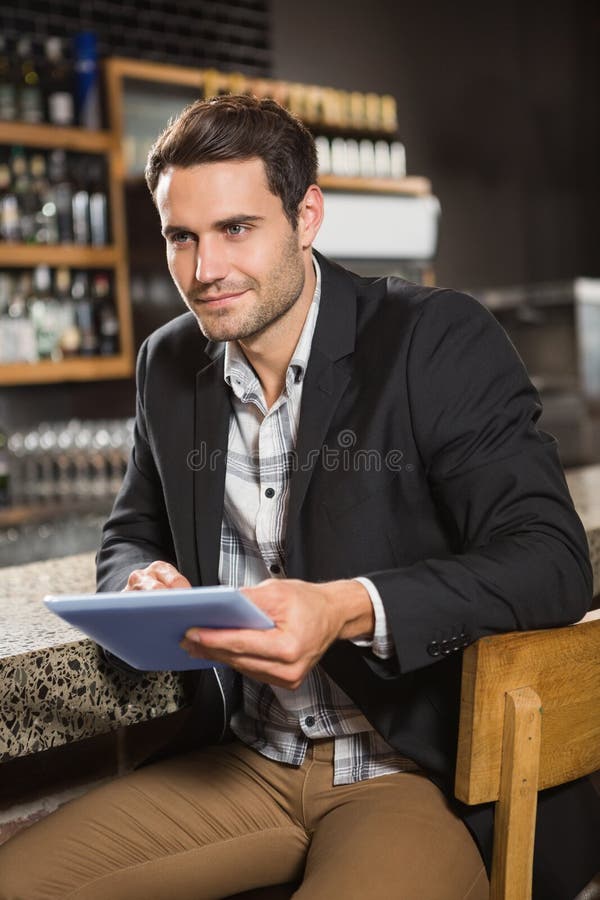 Handsome man using tablet stock image. Image of clothing - 67563621