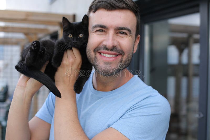 Handsome Man with a Very Cute Black Baby Cat Stock Image - Image of ...