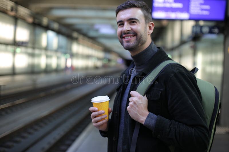 Handsome Man Waiting for a Train with Coffee Cup Stock Photo - Image of ...