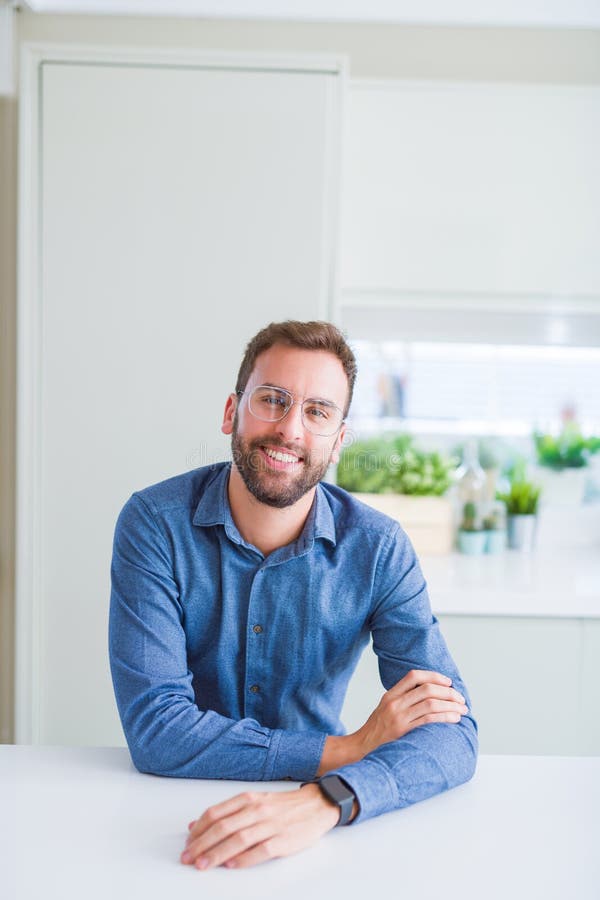 Handsome Man Wearing Glasses And Smiling Relaxed At Camera Stock Image
