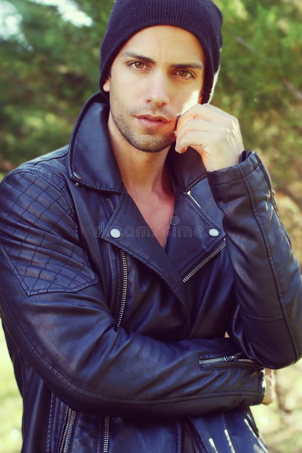 Handsome Man Wearing a Leather Jacket and a Hat Stock Photo - Image of ...