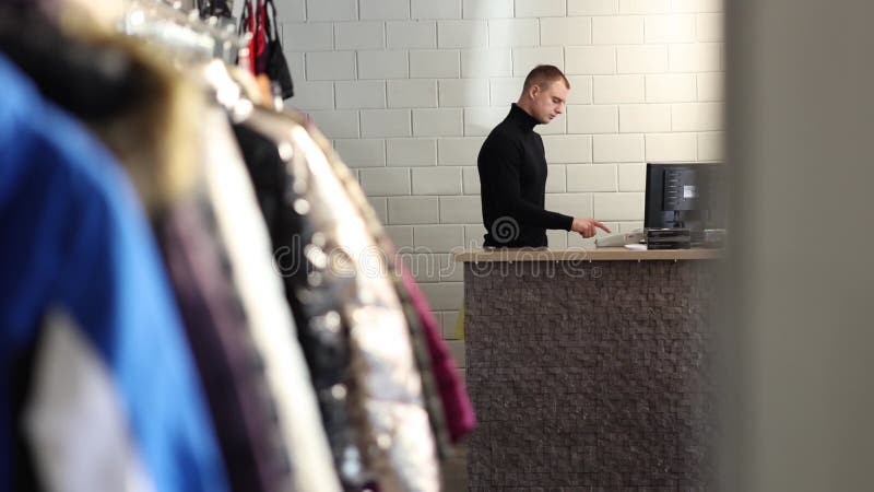 Handsome Man Worker Stands at the Checkout Using Computer. Close-up ...