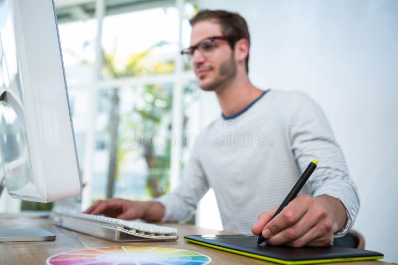Handsome Man Working on Computer and Taking Notes Stock Image - Image ...