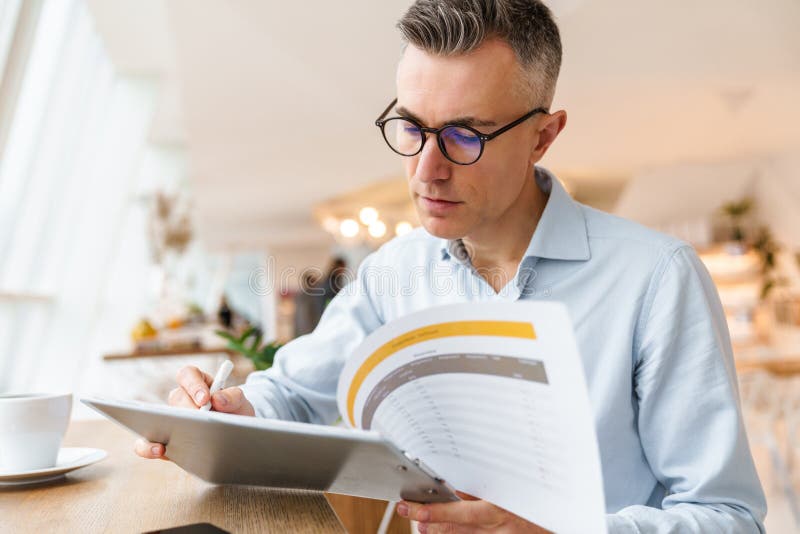 Handsome Man Working with Documents in Cafe Stock Image - Image of ...