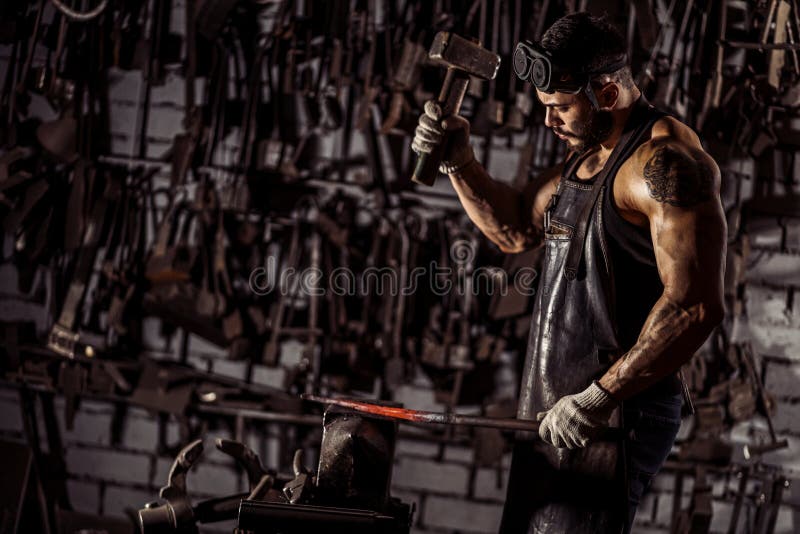 Handsome Man Working with Hammer at Workshop Stock Photo - Image of ...