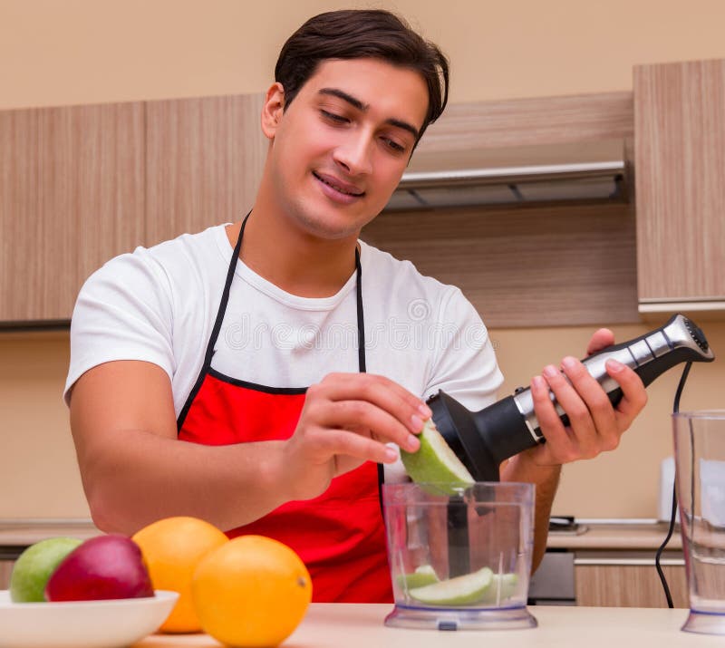 Handsome Man Working at the Kitchen Stock Photo - Image of apron, apple ...