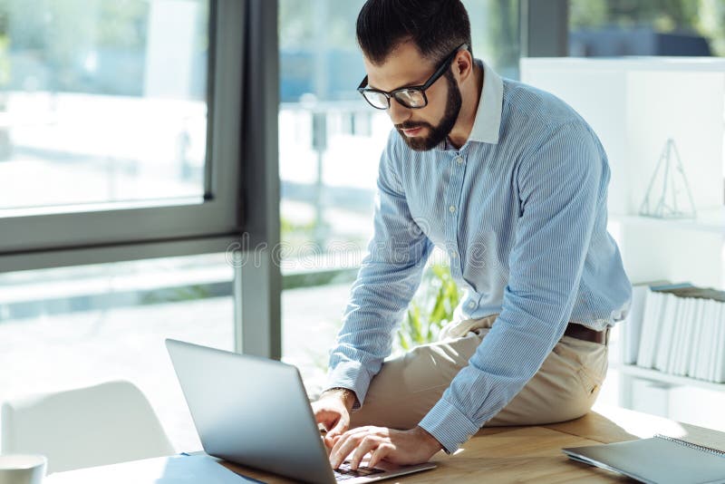 Handsome Man Working on Laptop while Sitting on Table Stock Photo ...