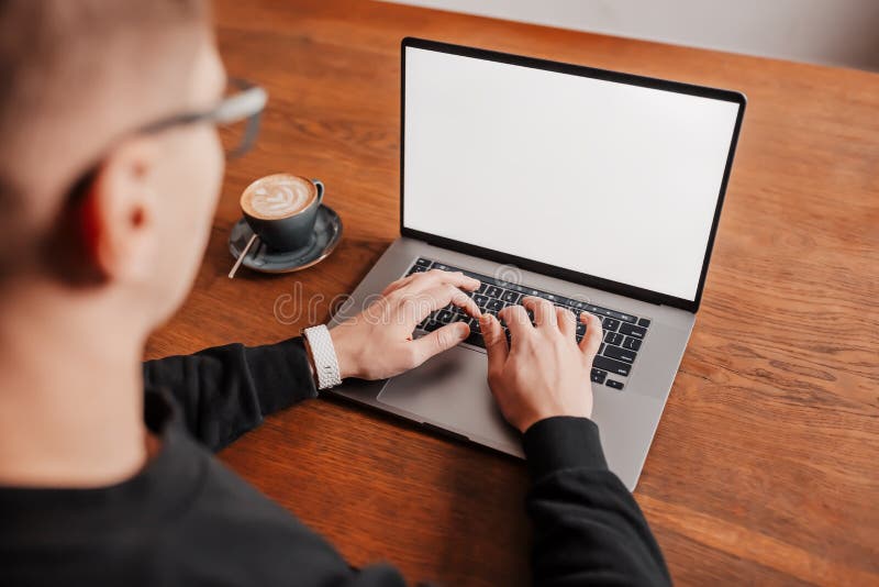 Handsome Man Working on Laptop in the Workplace. Businessman Typing ...