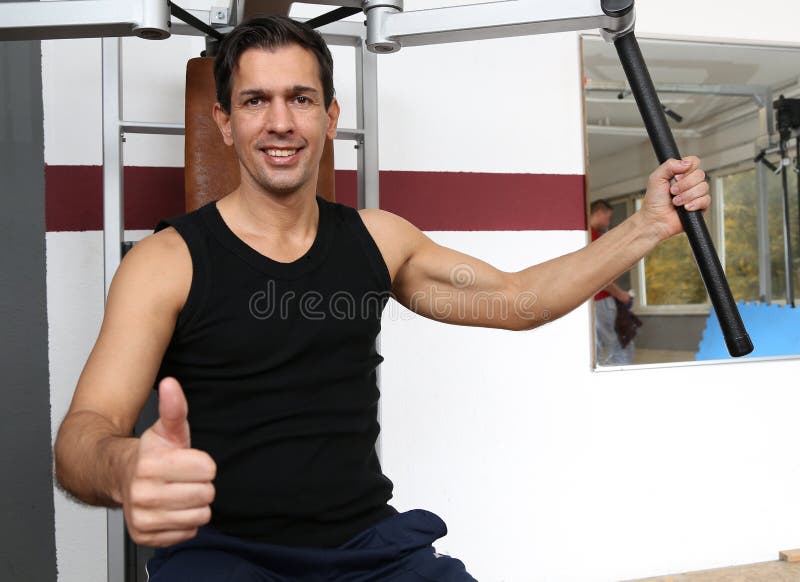 Smiling Shirtless Young Man Doing Sit Ups in Fitness Studio Stock Photo ...