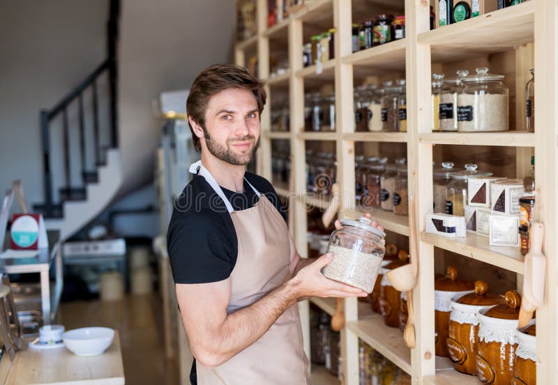 Handsome Man Working in Package-free Store Using Reusable Containers ...