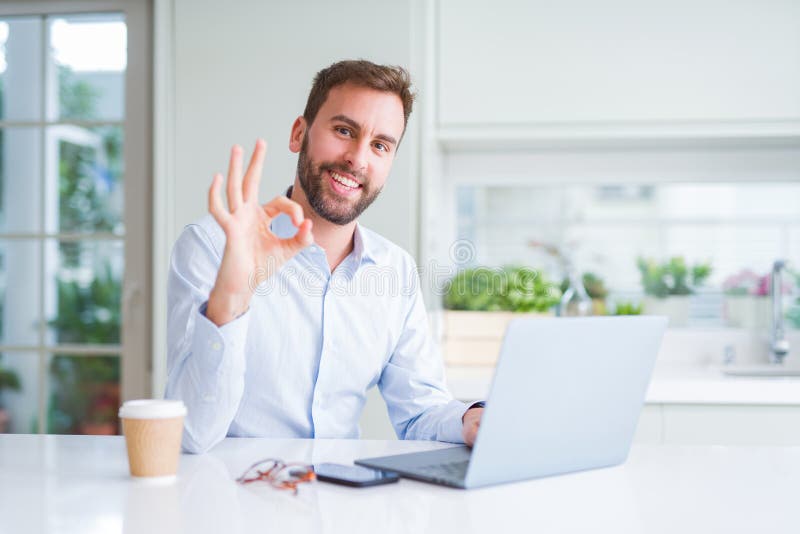 Handsome Man Working Using Computer Laptop and Drinking a Cup of Coffee ...