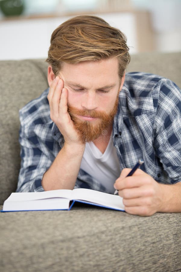 Handsome Man Writing in Notebook while Studying at Home Stock Image ...