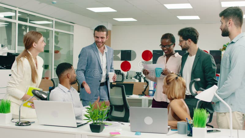 A Handsome Manager Walks into a Modern Office Room, Shaking Everyone S ...