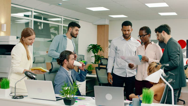 A Handsome Manager Walks into a Modern Office Room, Shaking Everyone S ...