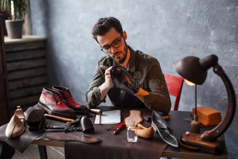 Handsome Master Reparing the Sole of Boots Stock Photo - Image of ...