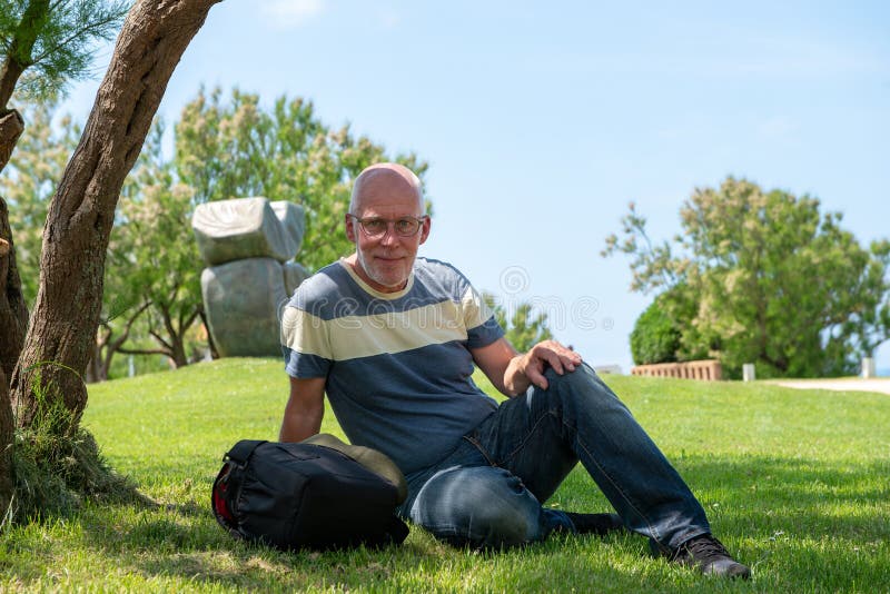 Handsome Mature Man Is Resting Under A Tree Stock Image - Image of ...