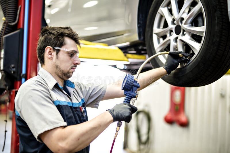 Handsome Mechanic Job in Uniform Working on Car Stock Photo - Image of ...