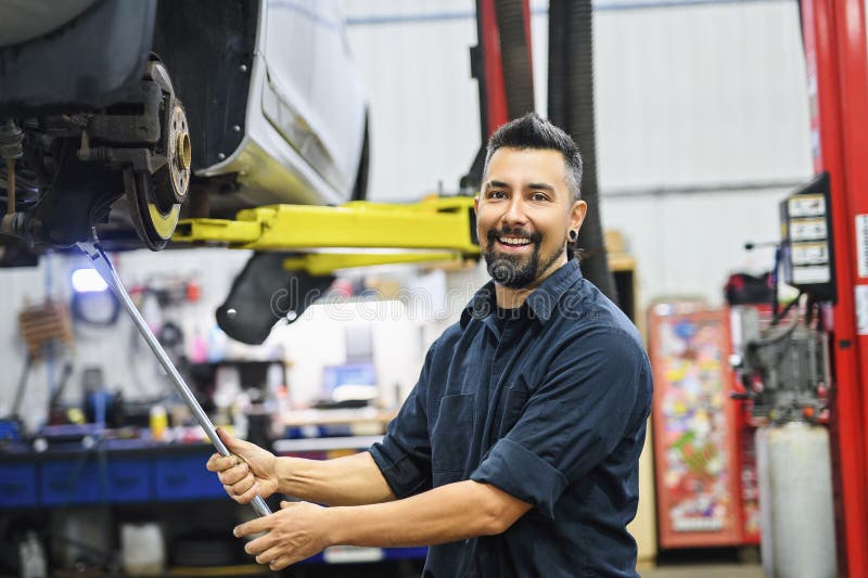 Handsome Mechanic Job in Uniform Working on Car Stock Image - Image of ...