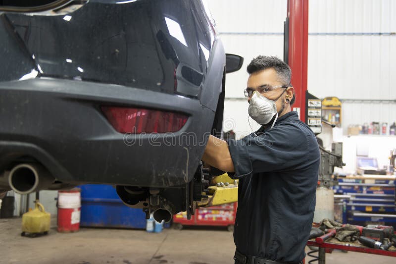 Handsome Mechanic Job in Uniform Working on Car Stock Image - Image of ...