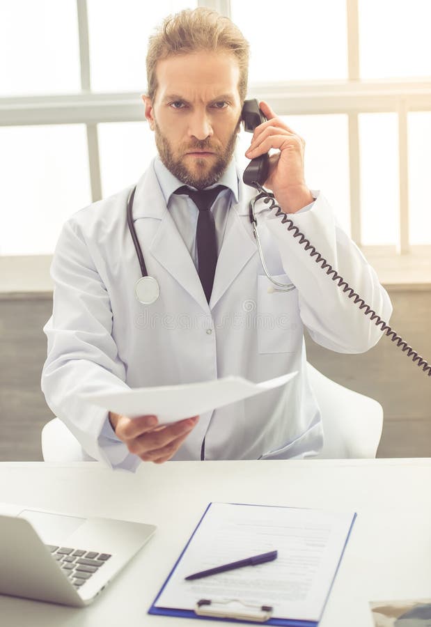 Handsome medical doctor stock image. Image of phone, care - 78526627