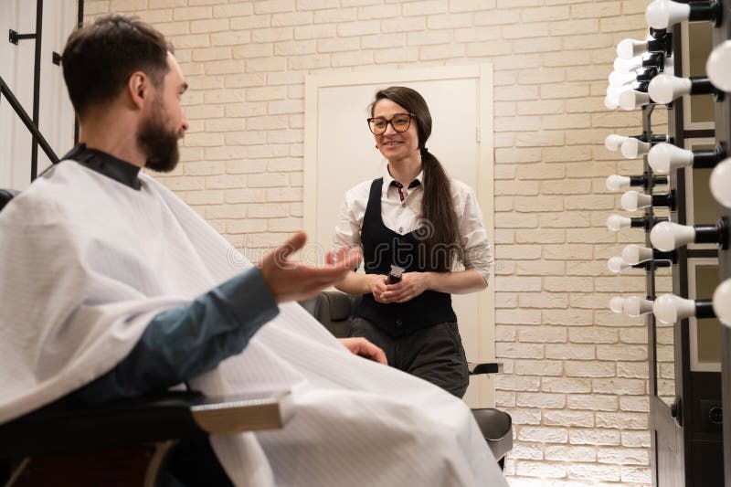 Handsome Man Communicates with the Master in the Barbershop Stock Image ...
