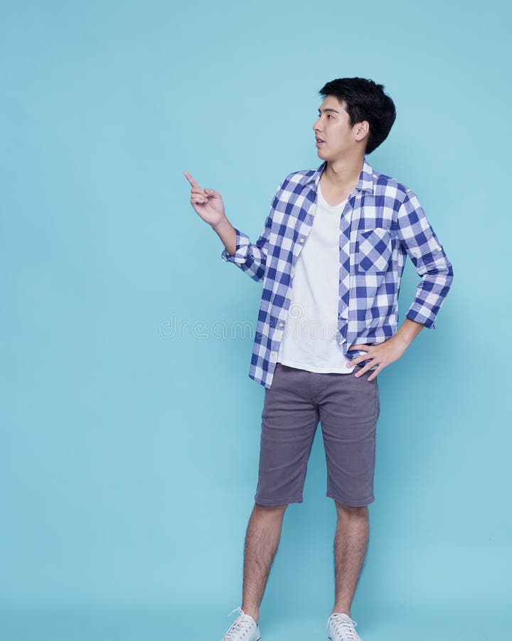 Handsome Men Pointing on Blue Background Stock Image - Image of person ...