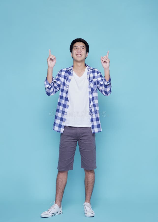 Handsome Men Pointing on Blue Background Stock Photo - Image of length ...