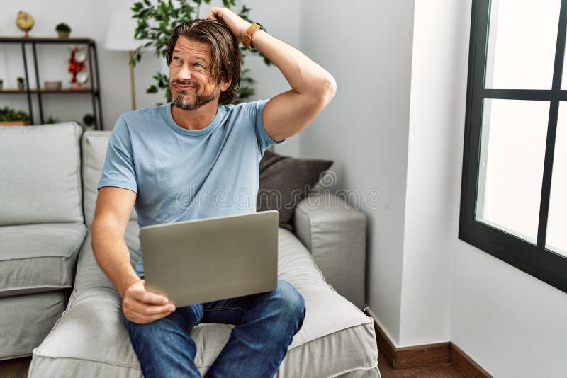 Handsome Middle Age Man Using Computer Laptop on the Sofa Confuse and ...